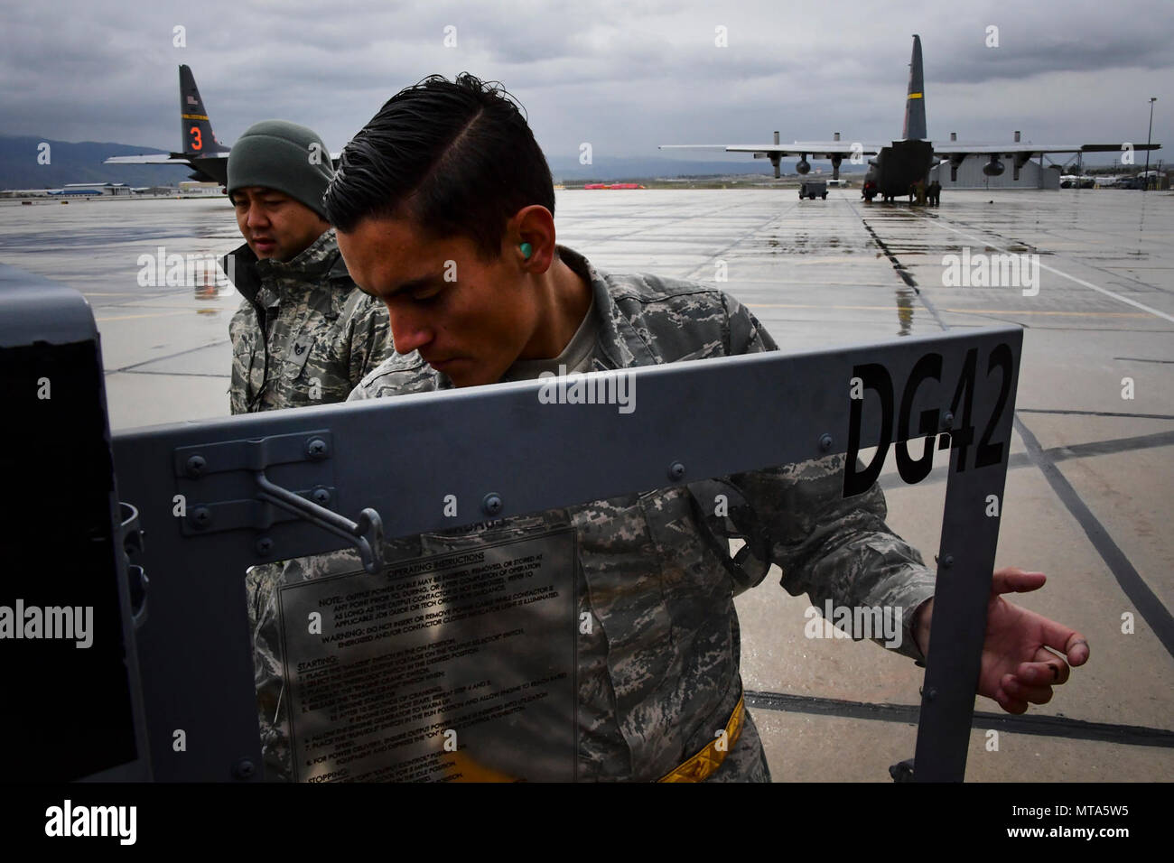 U.S. Air National Guard members Senior Airman Santos Casaus and Staff ...