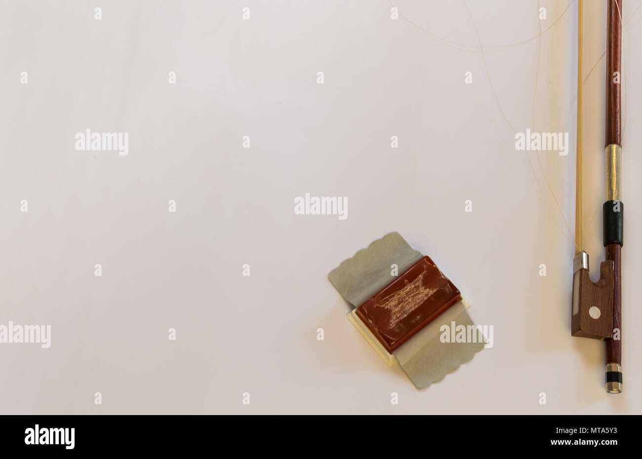 Violin bow and rosin case to apply in the bow hair. Materials for ...