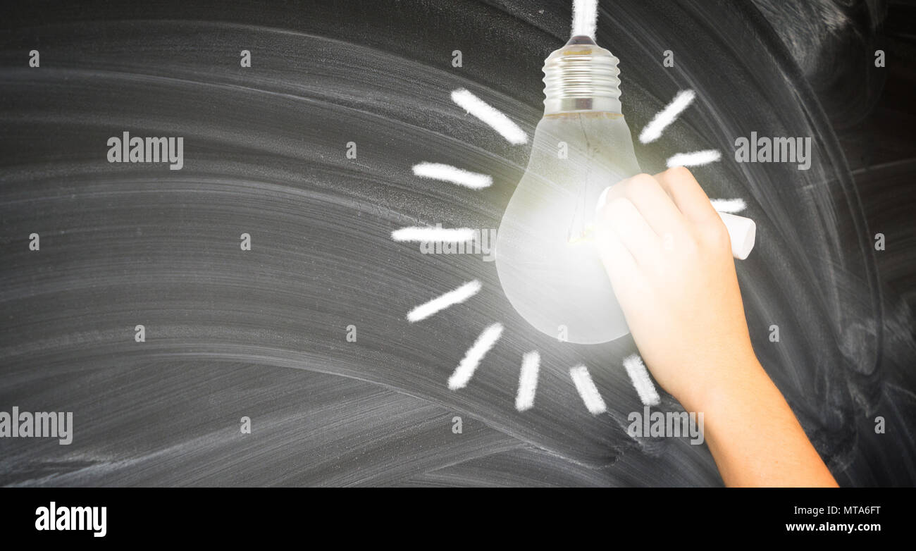 Hand with chalk painting glowing bulb on black board banner Stock Photo ...