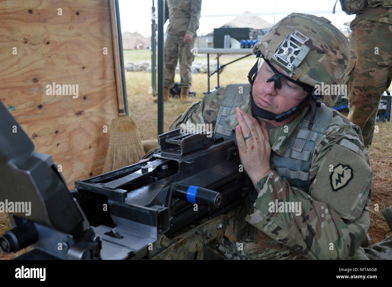 Staff Sgt. Joshua Kendrick learns proper loading and clearing ...