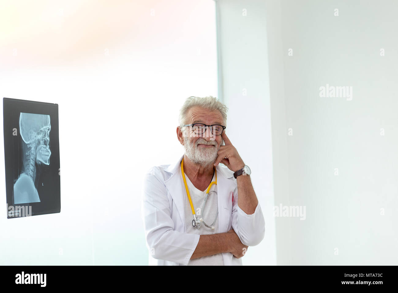 Senior medical doctor or chief doctor or Surgeon are checking skull of ...