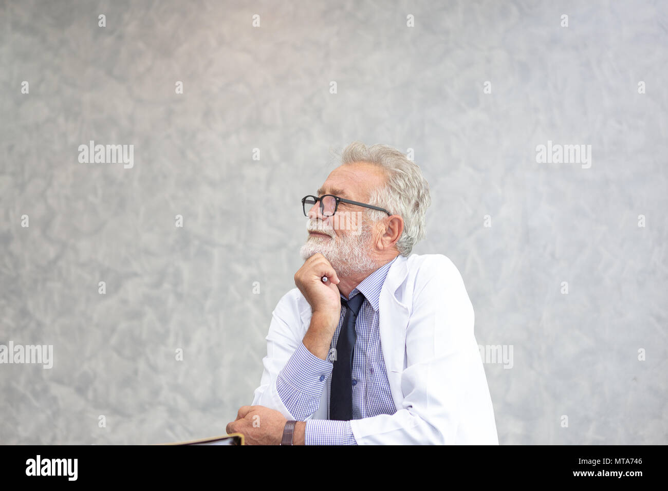 Senior medical doctor or chief doctor or Surgeon are checking skull of ...