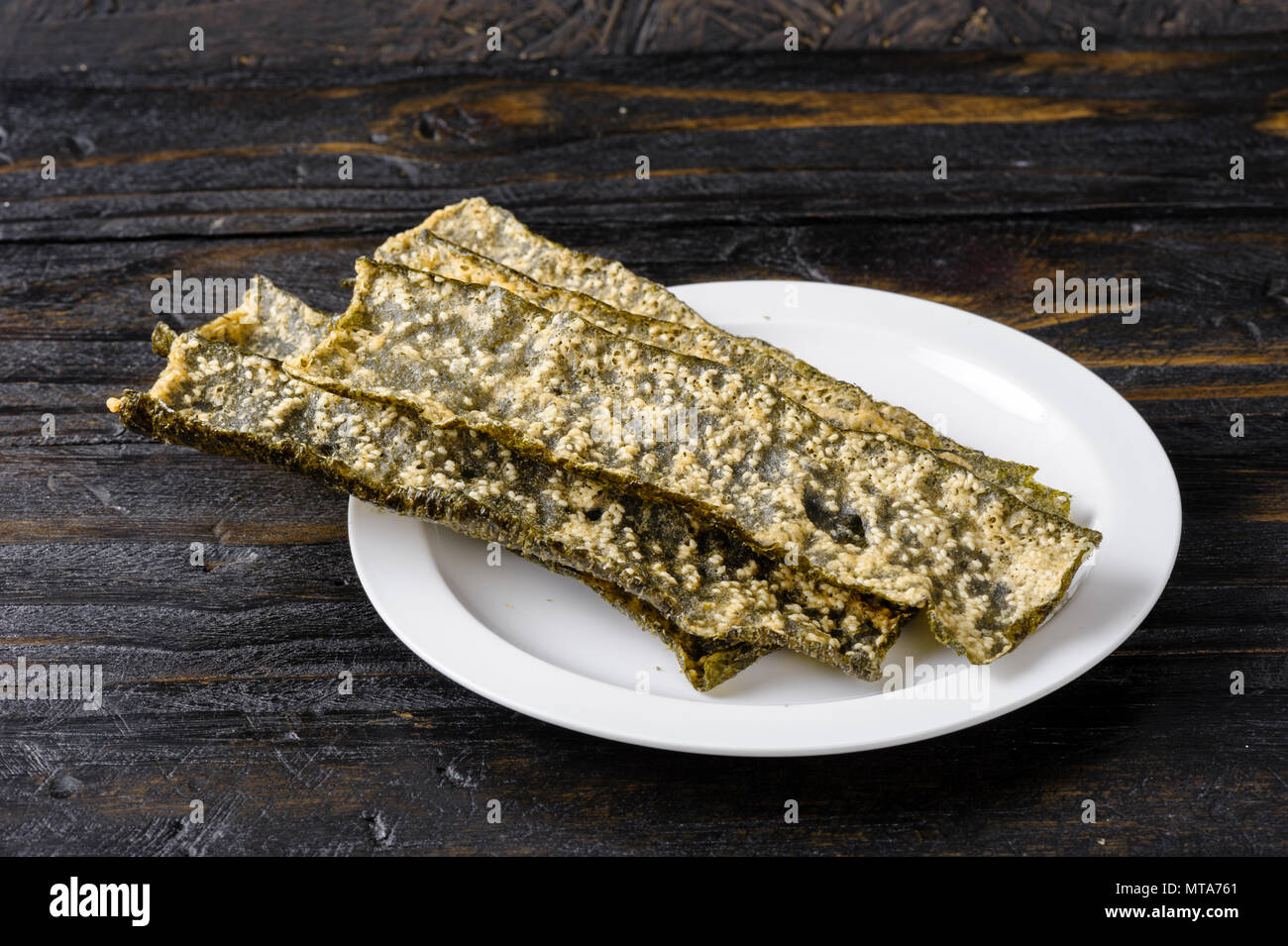 Deep fired seaweed sticks with white sesame Stock Photo - Alamy
