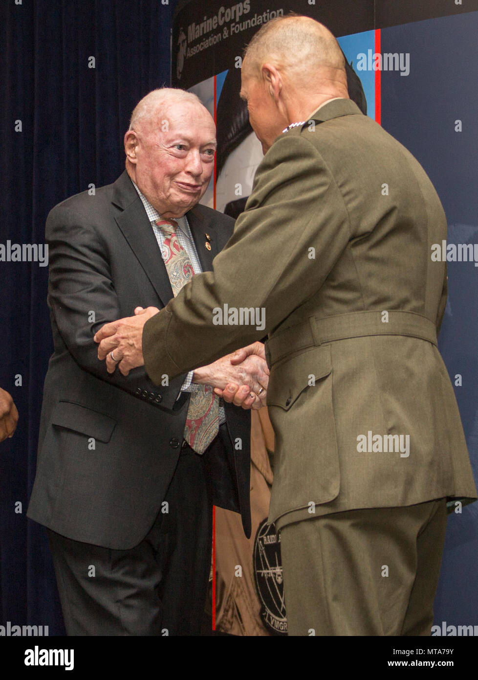Commandant of the Marine Corps Gen. Robert B. Neller, right, shakes ...