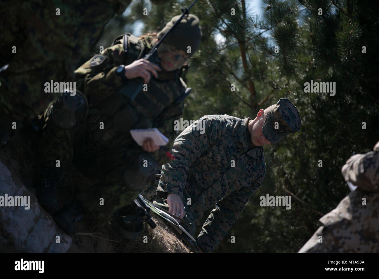 A U.S. Marine with Black Sea Rotational Force 17.1 and an Estonian ...