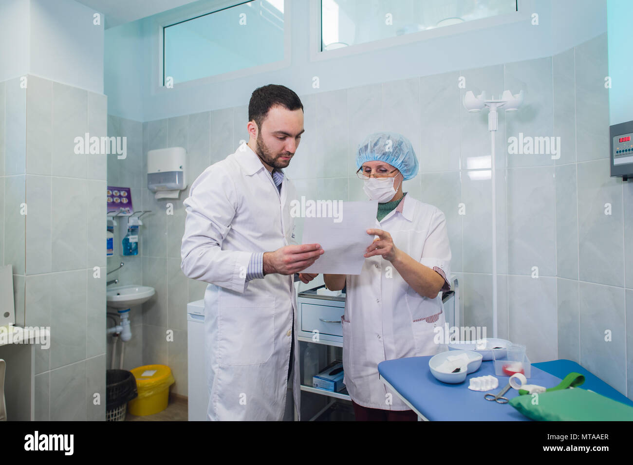 Healthcare: Doctor and patient discussing blood-test results Stock ...