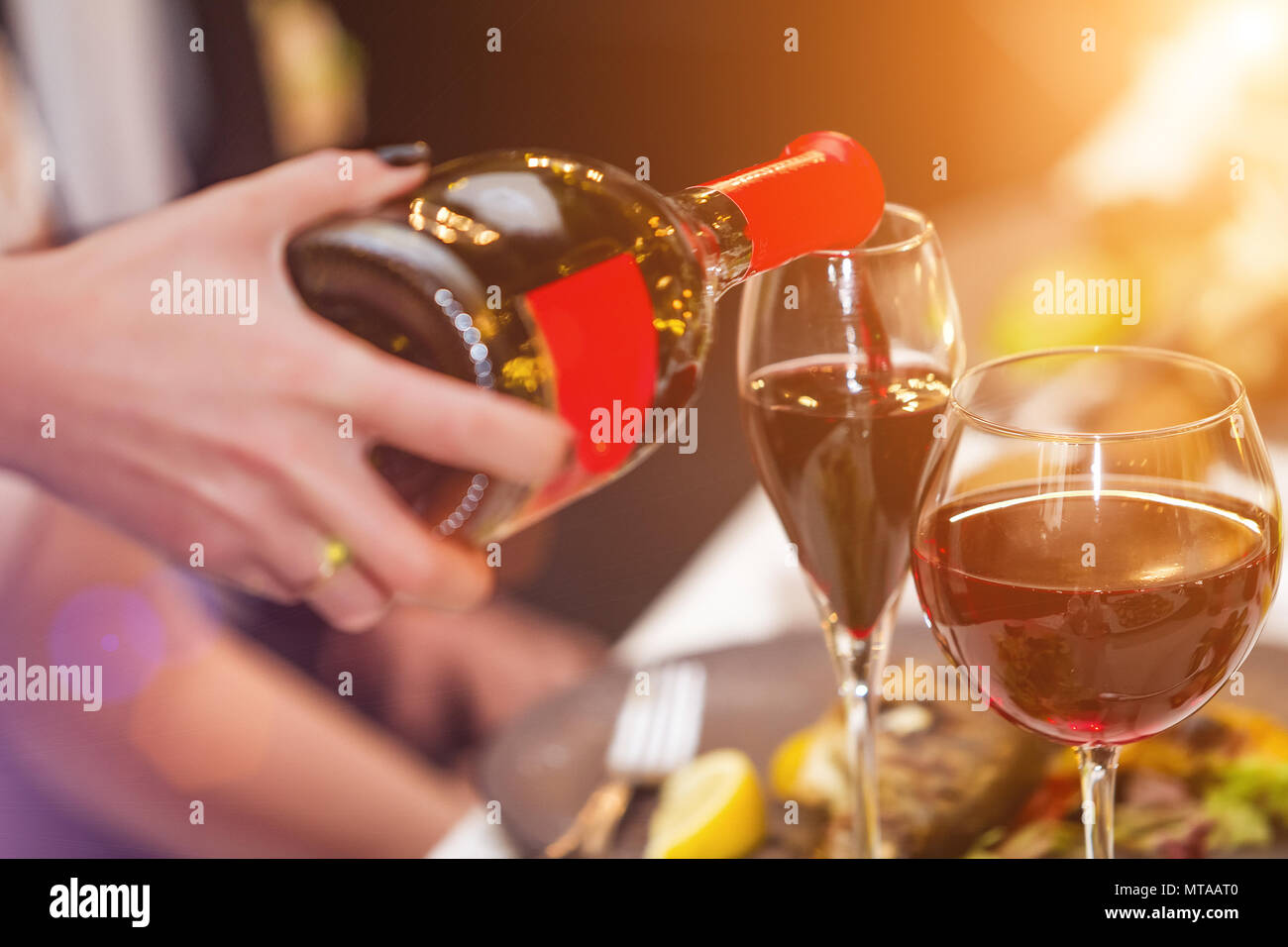 Man waiter pouring wine glass hi-res stock photography and images - Alamy