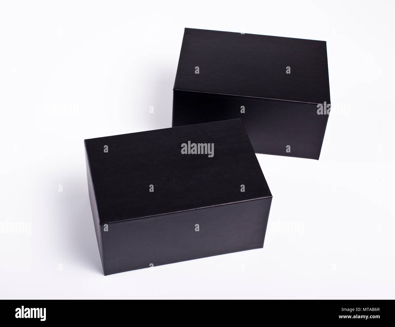 Black cardboard boxes for packaging on a white background Stock Photo ...