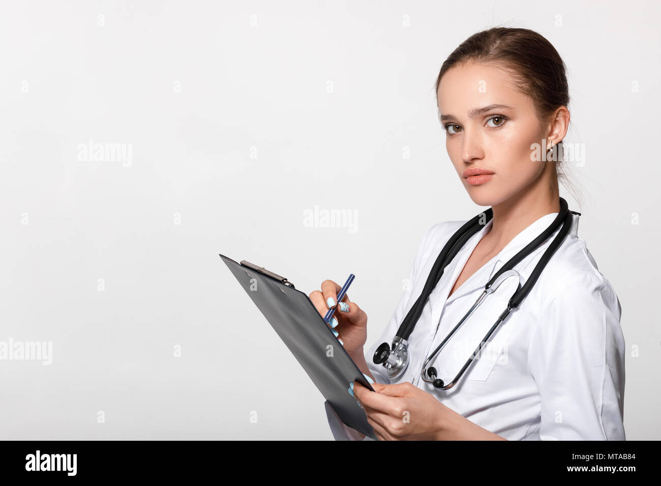 doctor holding folder Stock Photo - Alamy