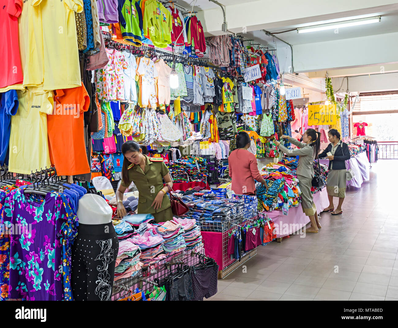 Clothes on sale in indoor market, Pakse, Champasak, Laos Stock Photo ...