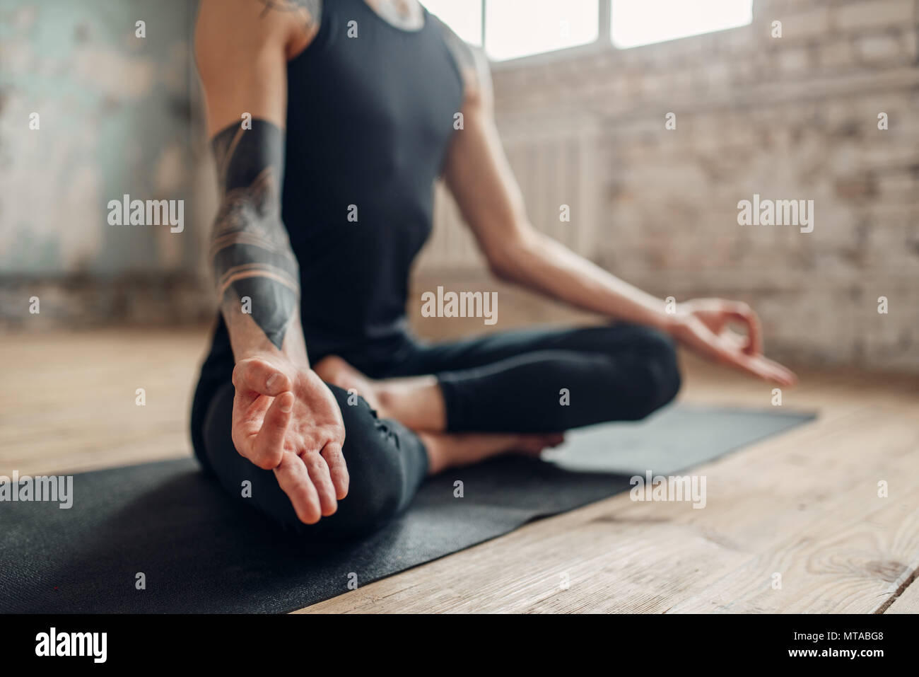 Male yoga, meditation in asana position, full relaxation. Fit workout ...