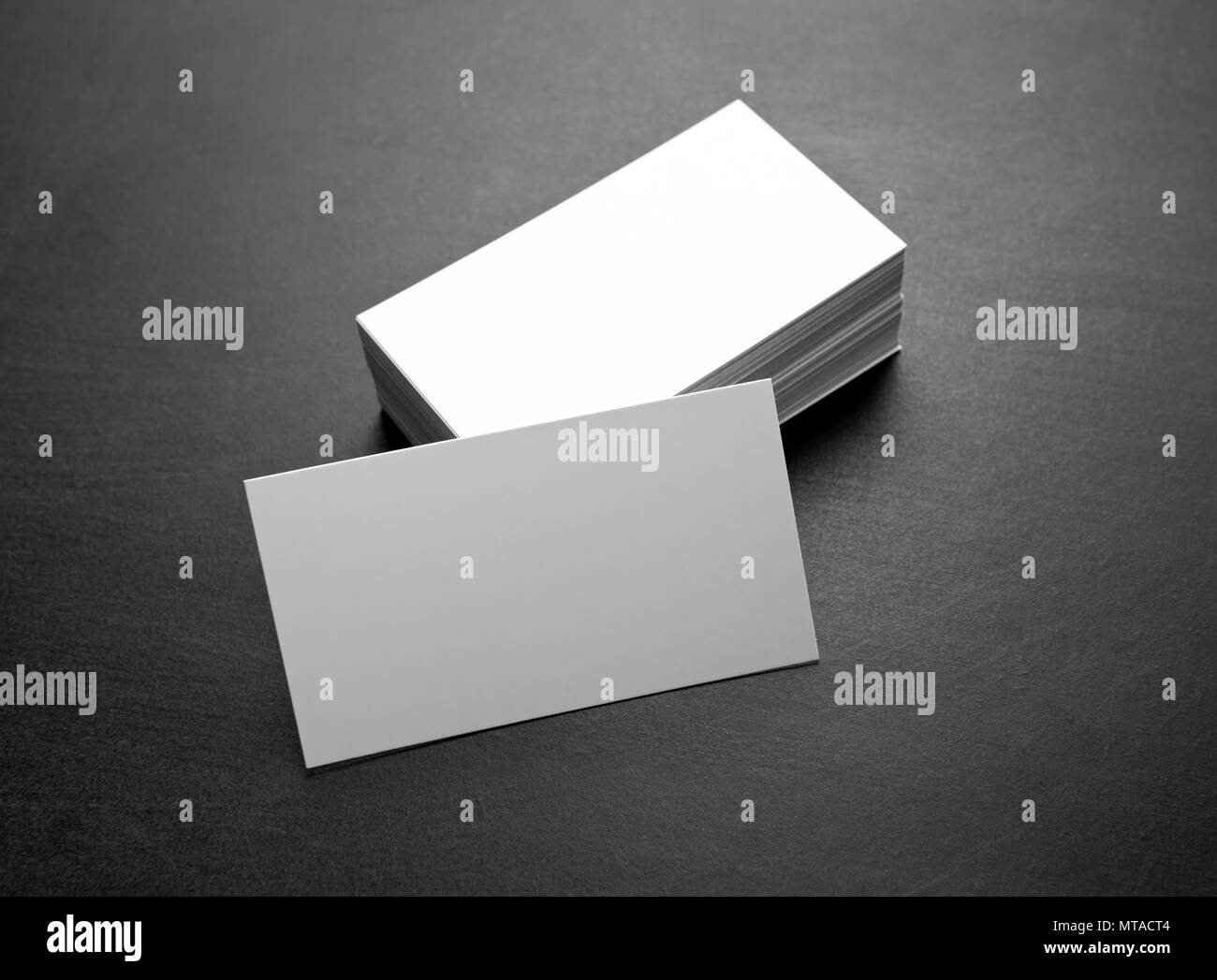 Blank business cards on a black background, identity design, corporate ...