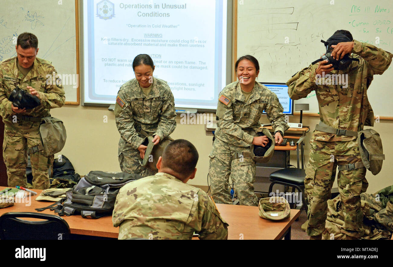 HONOLULU, Hawaii- University of Hawaii Army ROTC cadets attempt to don ...