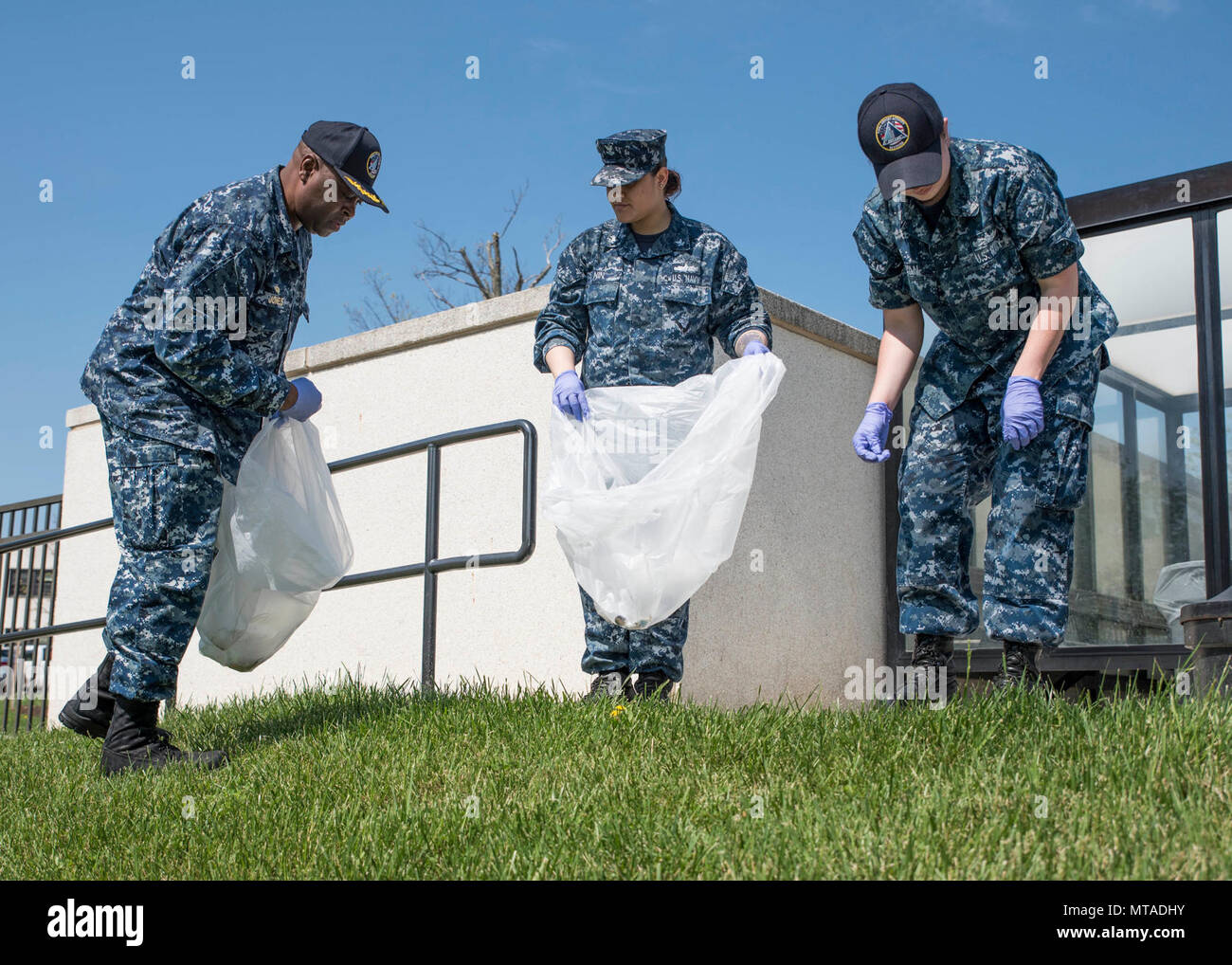 Sailors and civilians came together to celebrate Earth Day by picking ...