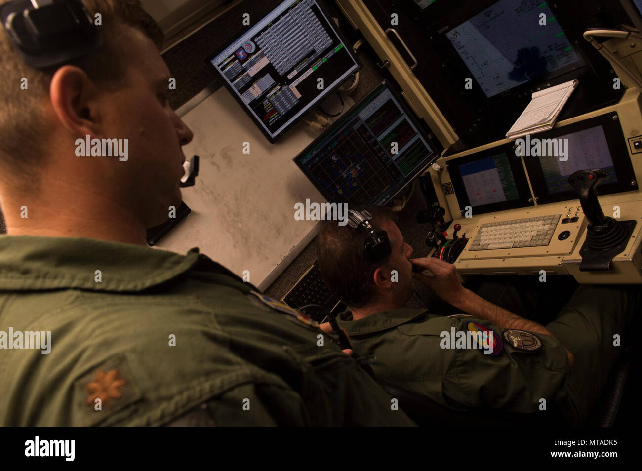 Maj. Aaron, a 29th Attack Squadron MQ-9 Reaper instructor pilot, left ...