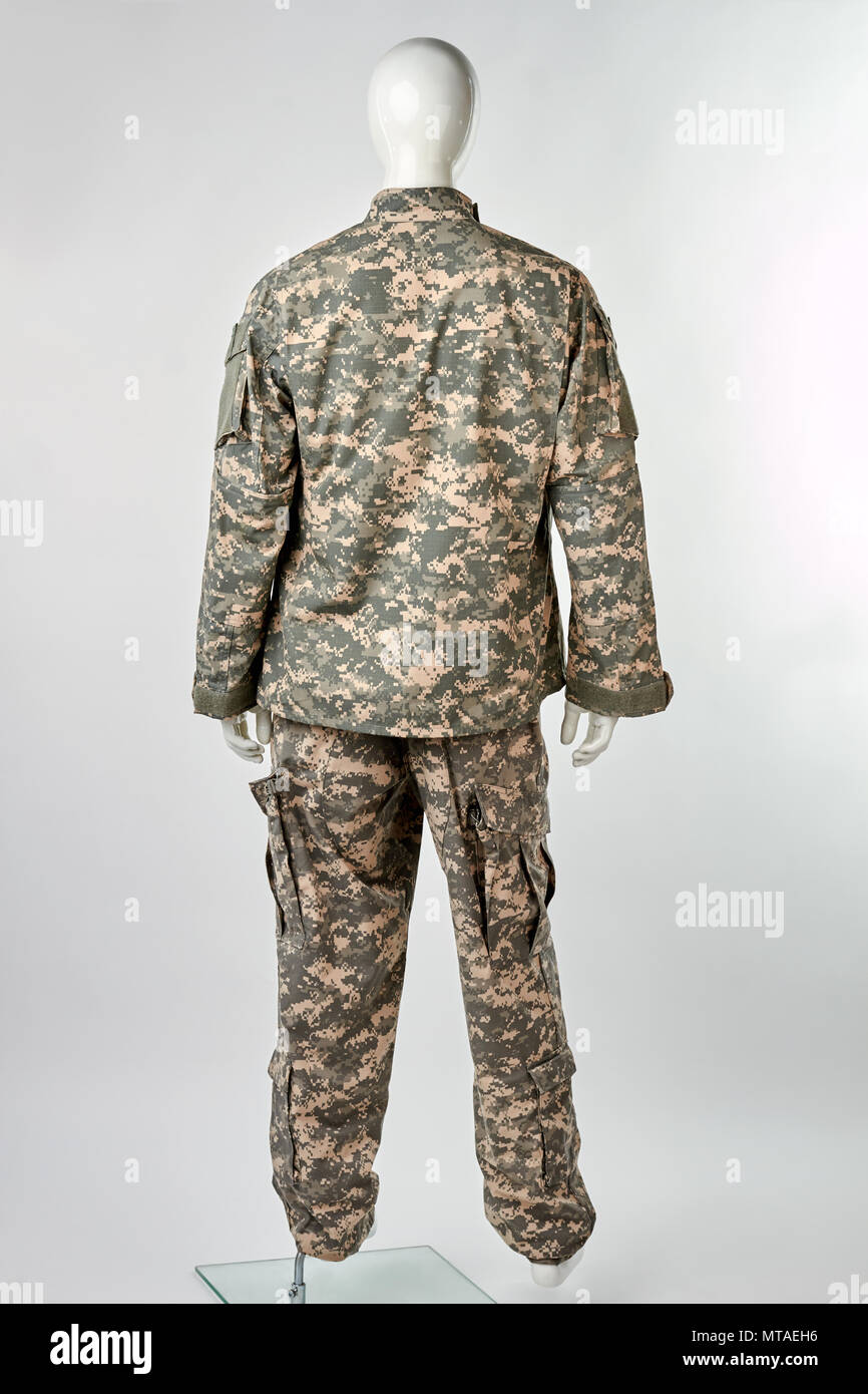 Full-length mannequin in military uniform, back view. White isolated ...