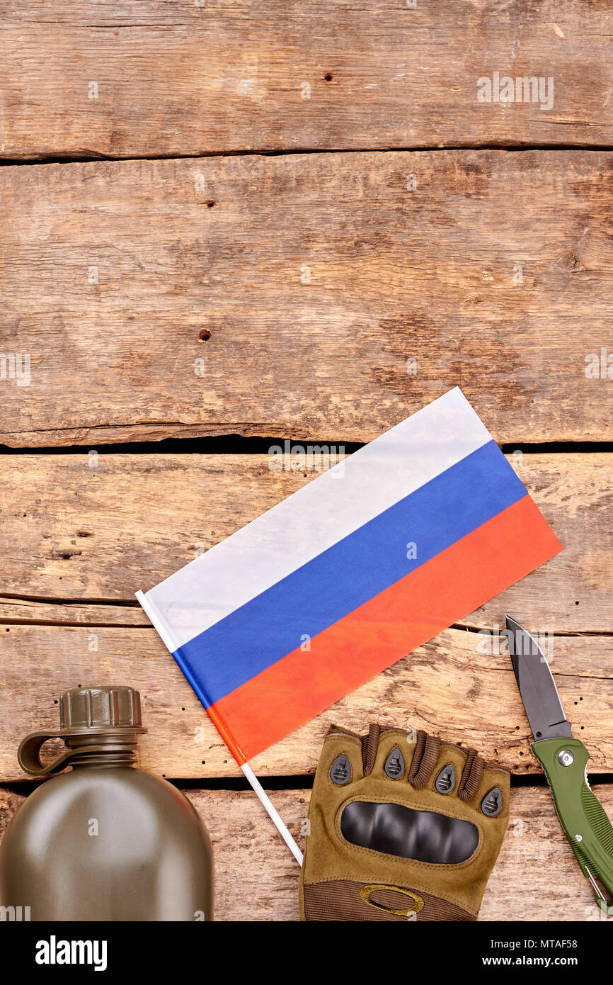 Equipment and essentials of russian soldier. Flat lay, top view. Wooden ...