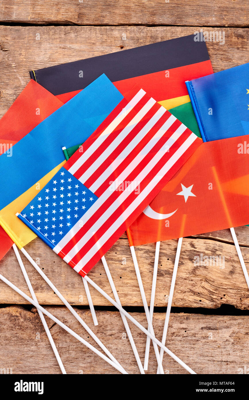 Flat lay arranged flags. Top view. Wooden desk background Stock Photo ...