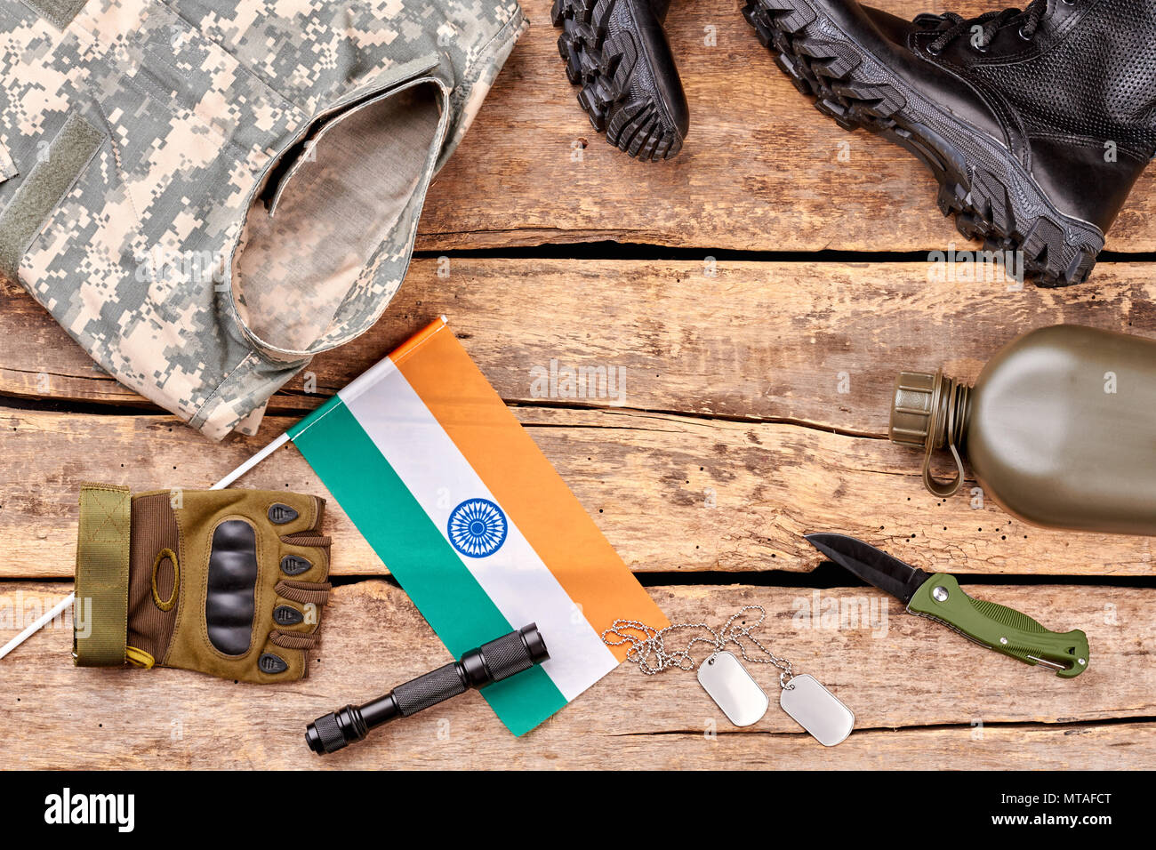 Indian army equipment flat lay. Wooden background, top view Stock Photo ...