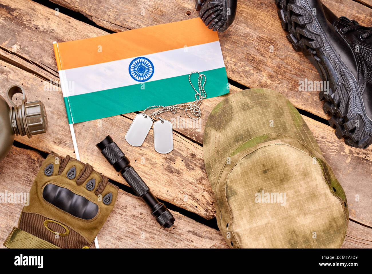 Set of indian soldier outfit on wooden background. Military things ...