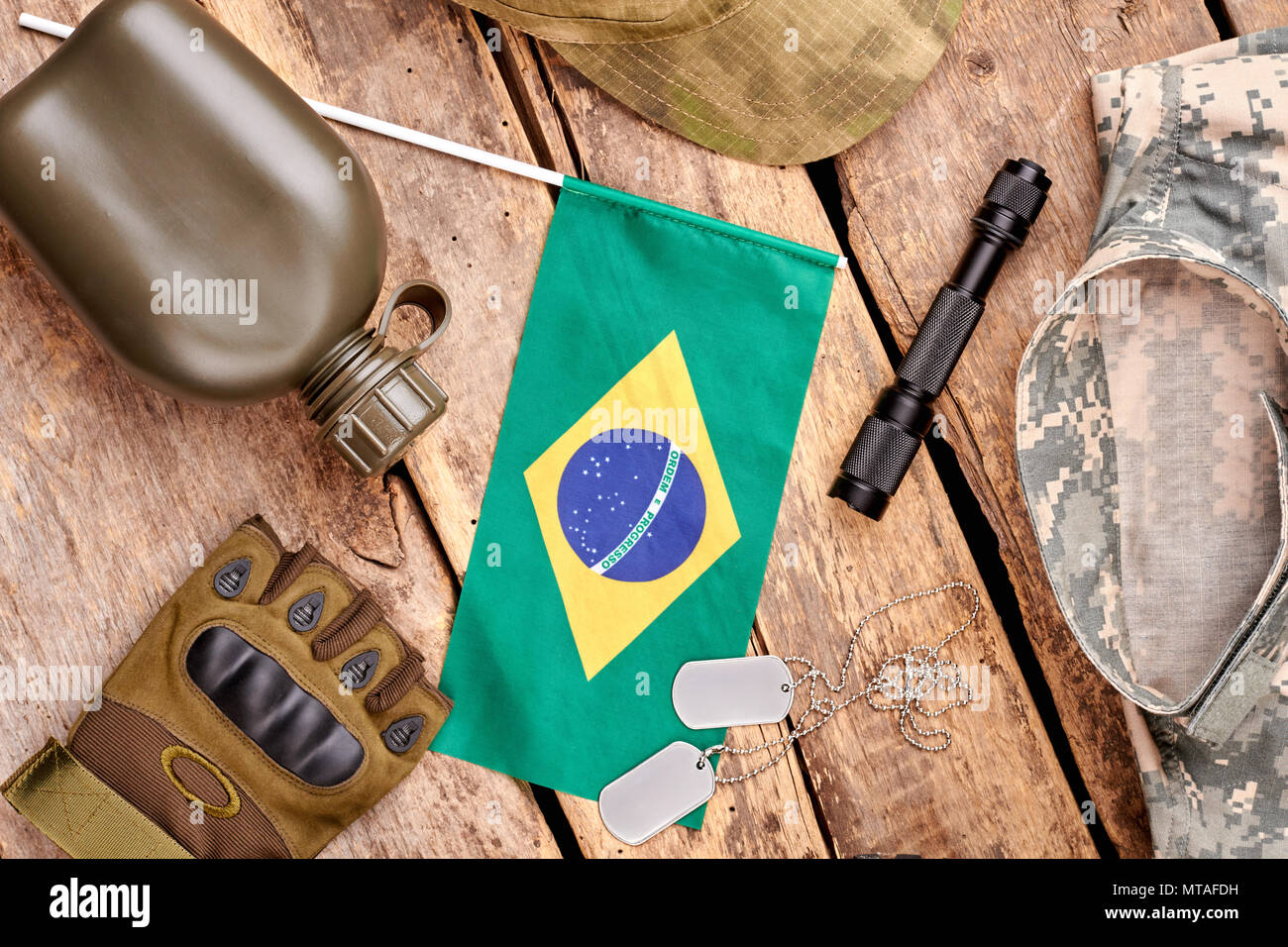 Brazilian army equipment flat lay. Top view. Wooden background Stock ...