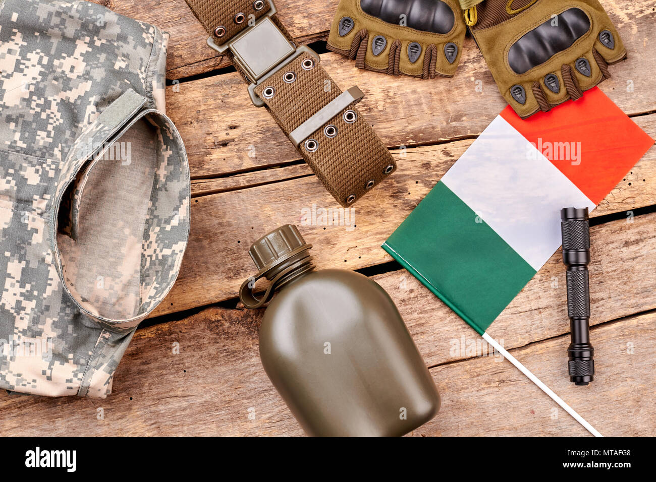 Italian army soldier items flat lay. Top view. Wooden background Stock ...