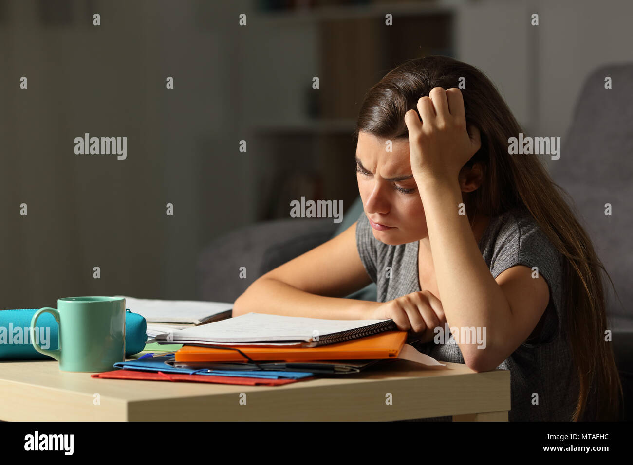 Tired student studying hard late hours in the night at home Stock Photo ...
