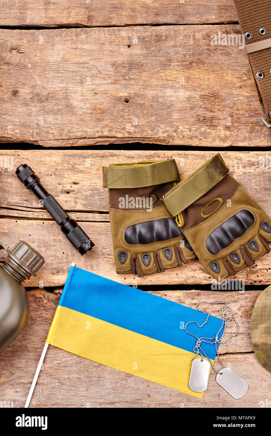 Ukrainian army soldier items arrangement with copyspace. Ukraine flag ...