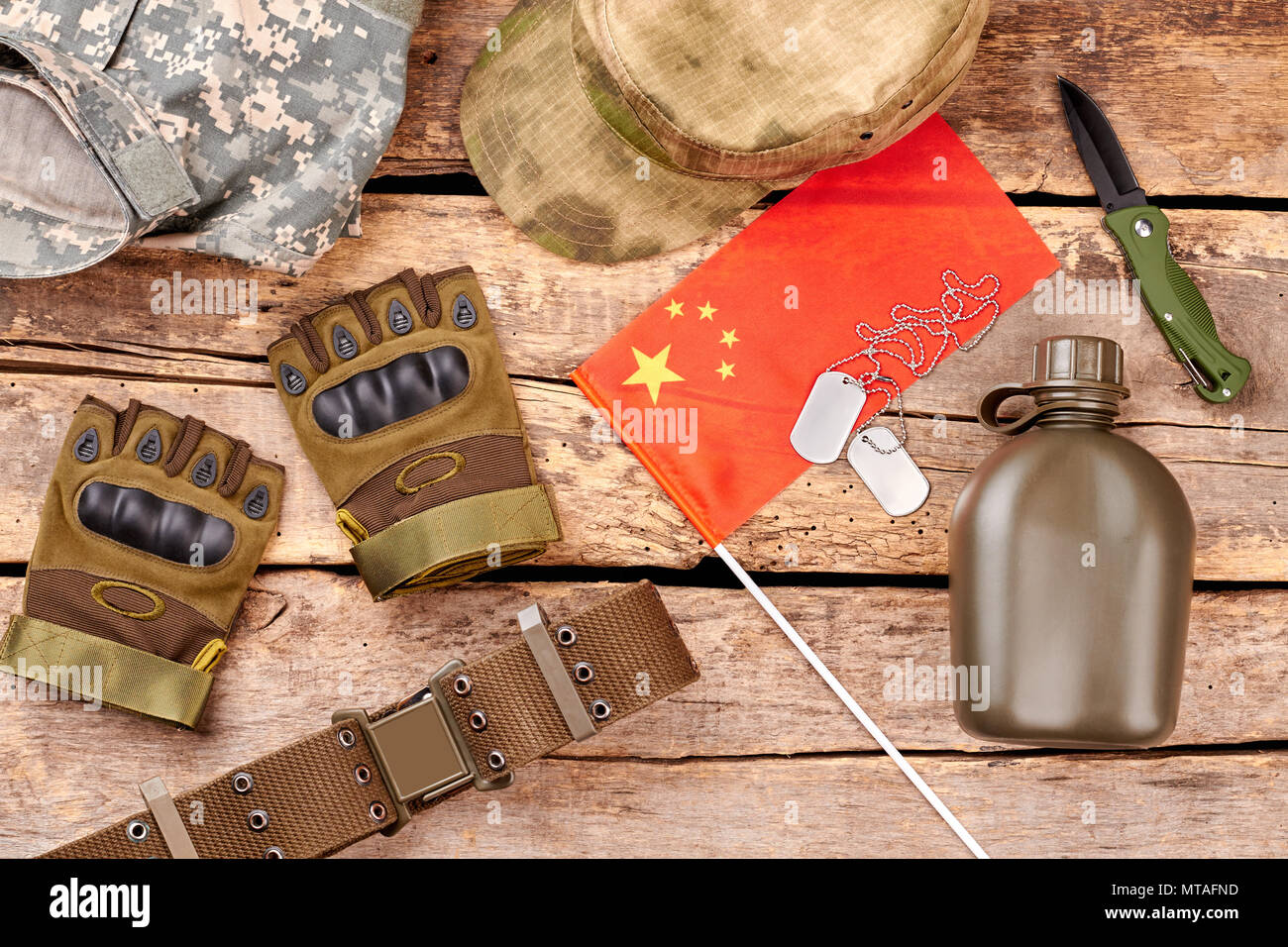 Chineese army soldier items flat lay. Top view, flat lay. Wooden ...