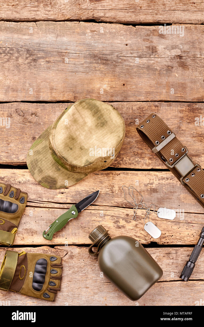Soldiers essentials on wood. Top view, flat lay. Military things and ...