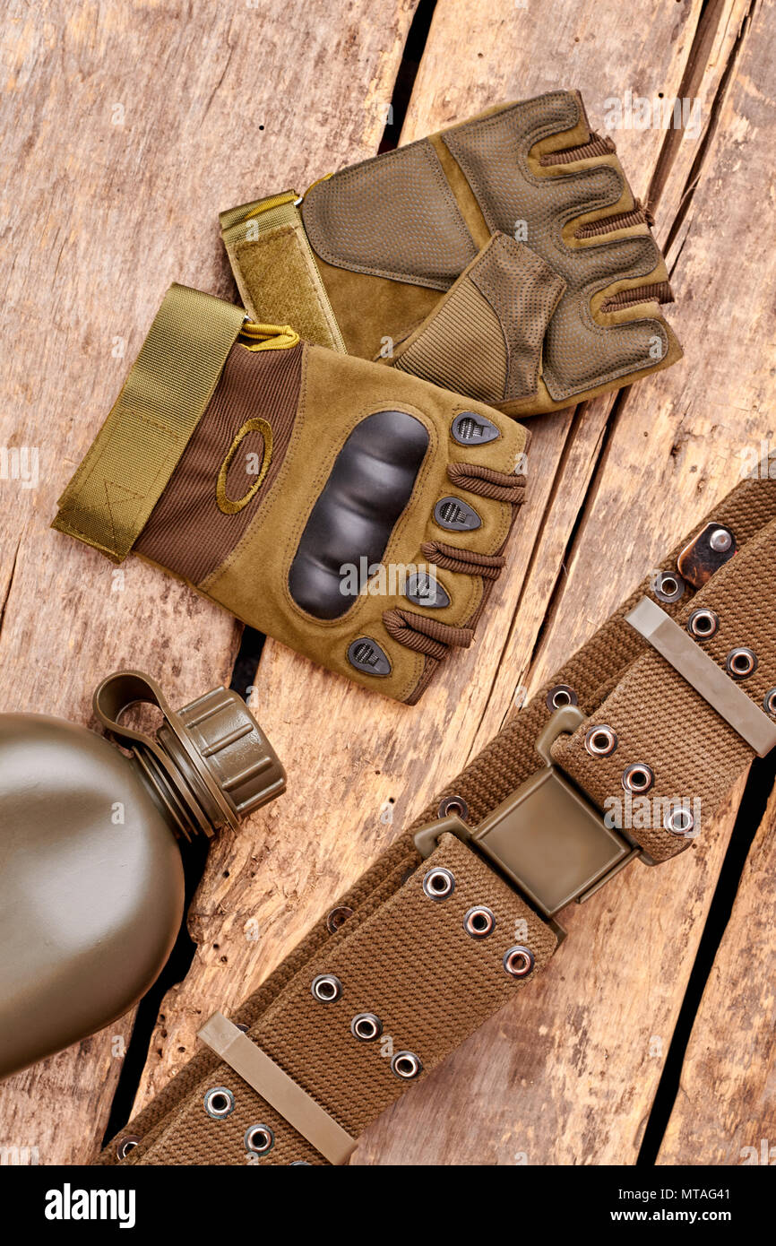 Military accessories on wood. Top view, flat lay Stock Photo - Alamy