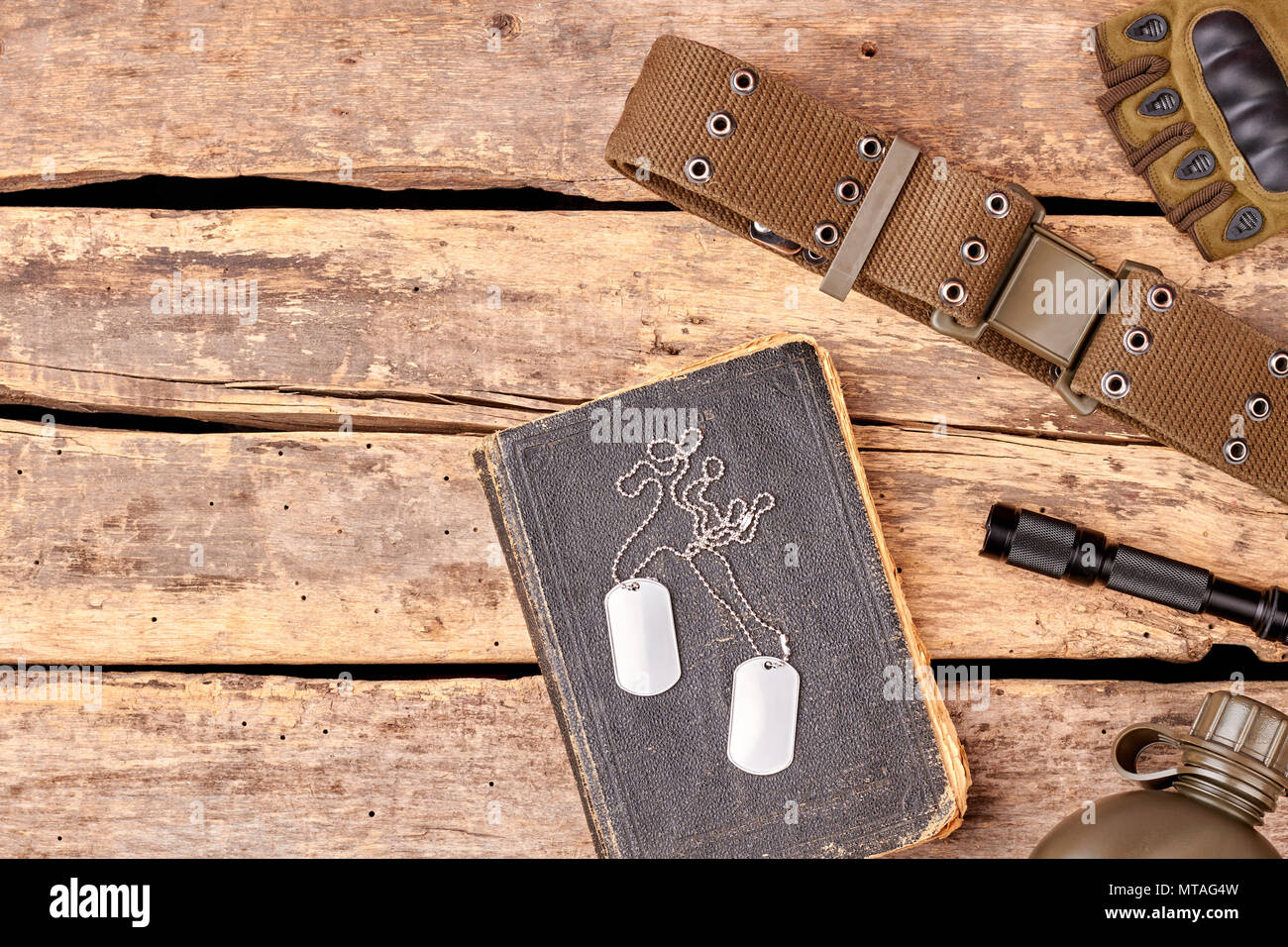 Military accessories and souvenirs, flat lay. Wooden desk surface ...