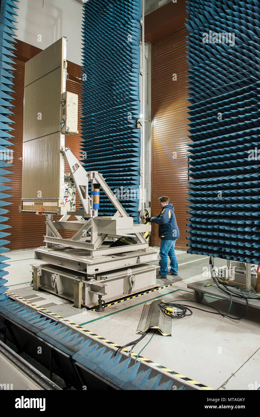 Electronics Mechanic Therese Paxton moves the radio frequency ...