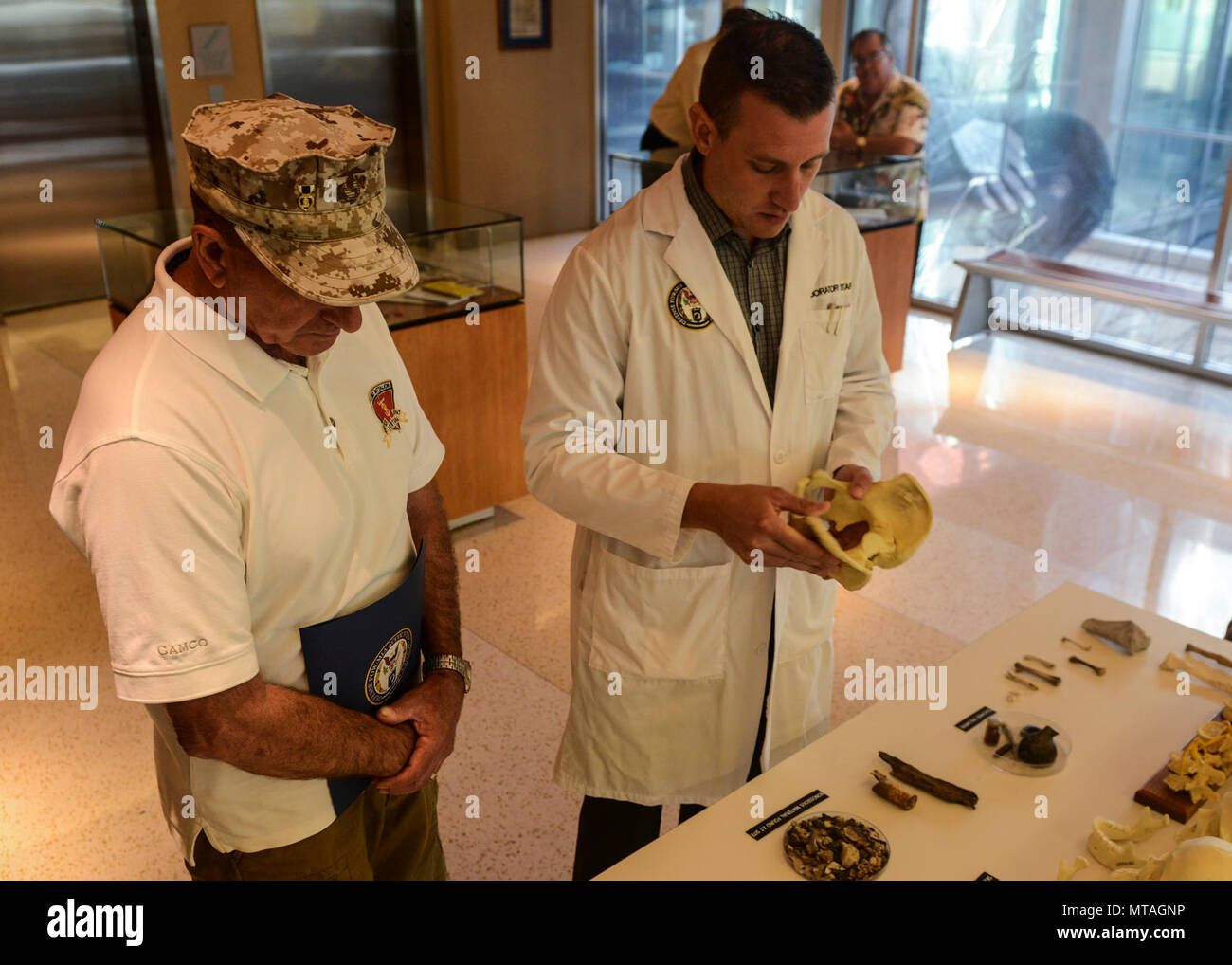 HONOLULU, Hawaii—Dr. Kyle Mccormick, an anthropologist with the Defense ...