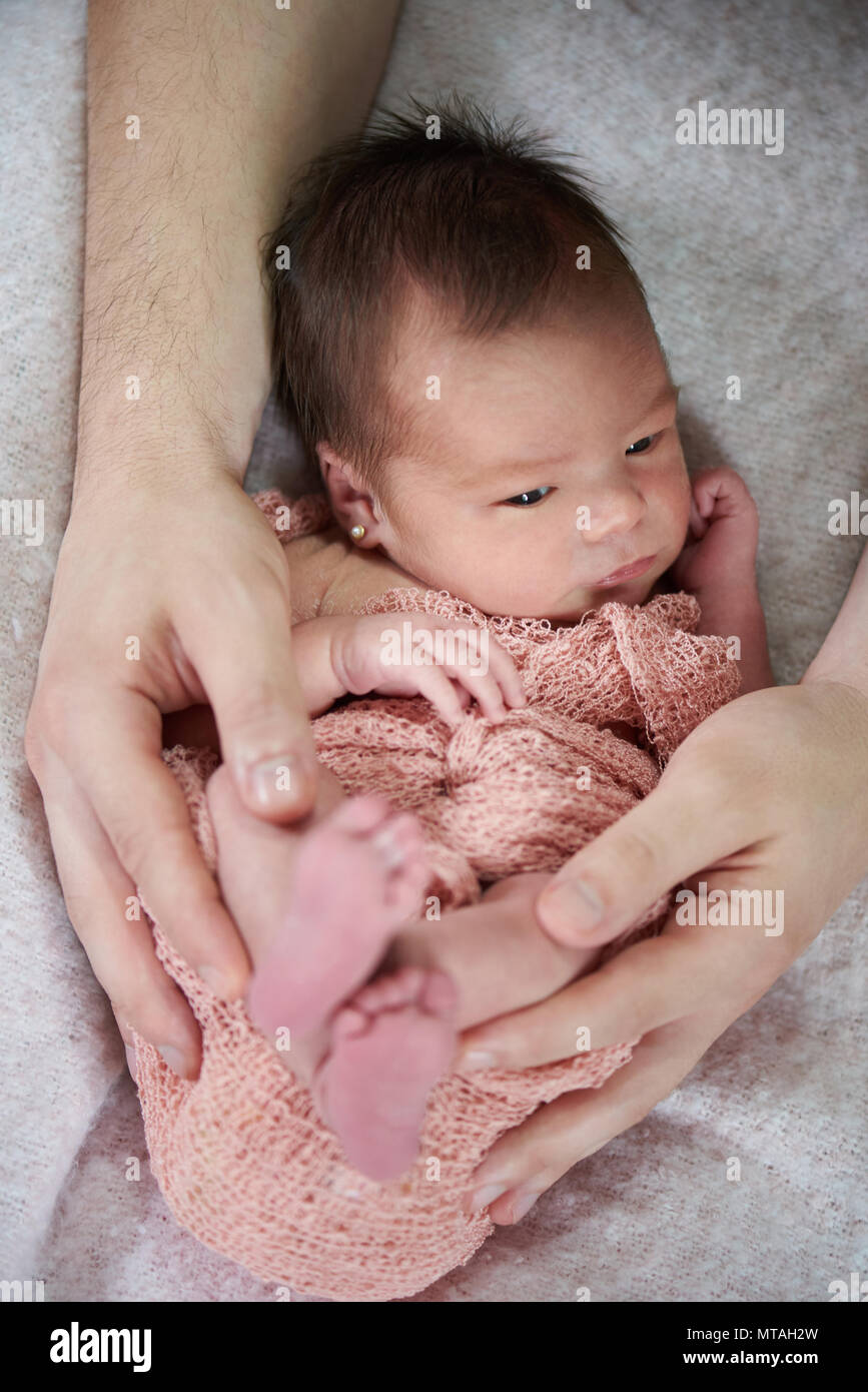 Father protecting newborn baby. Cover with parents arms baby theme ...