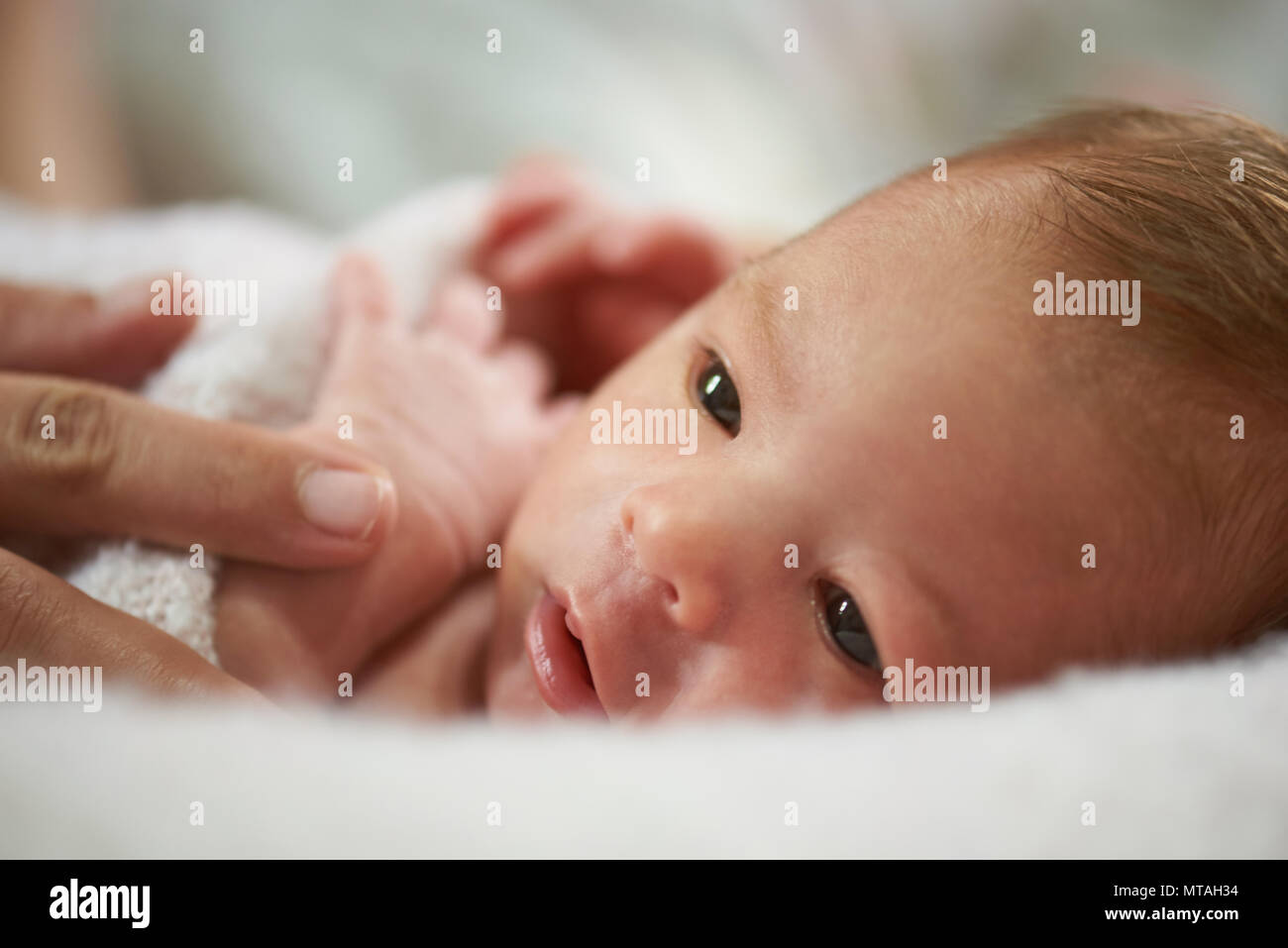Taking care of newborn baby theme. Portrait of happy baby Stock Photo ...