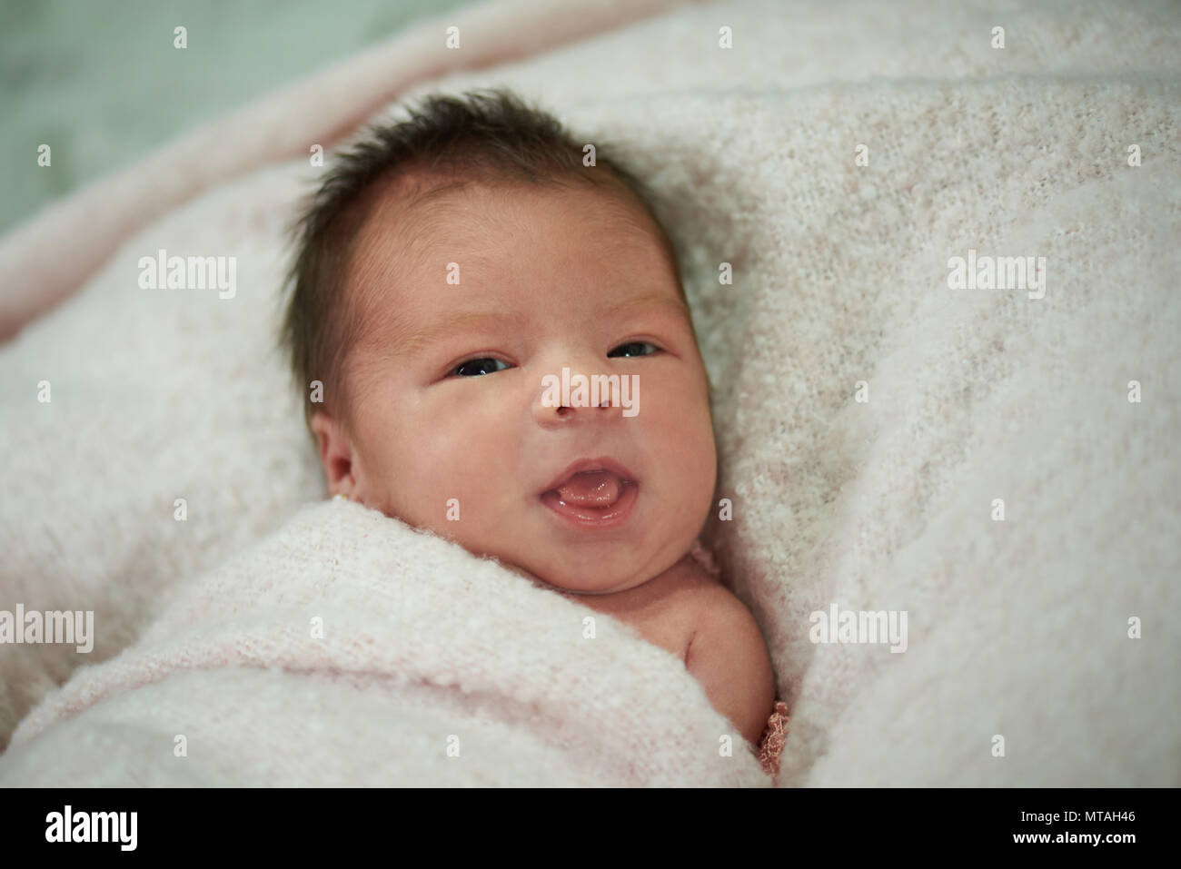 Smiling newborn baby portrait on soft bright background Stock Photo - Alamy