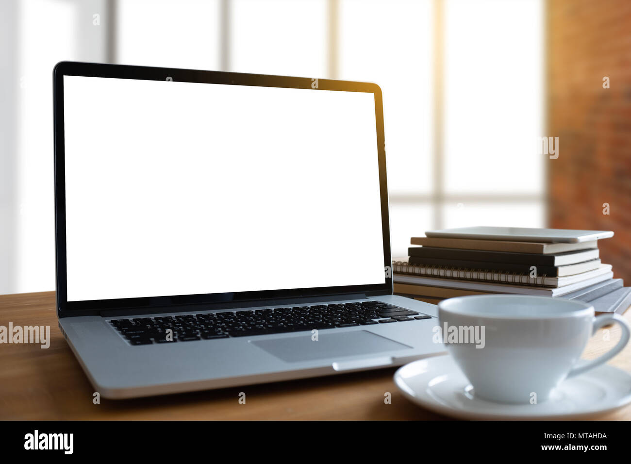 Laptop with blank screen on table. Workspace background new project on ...
