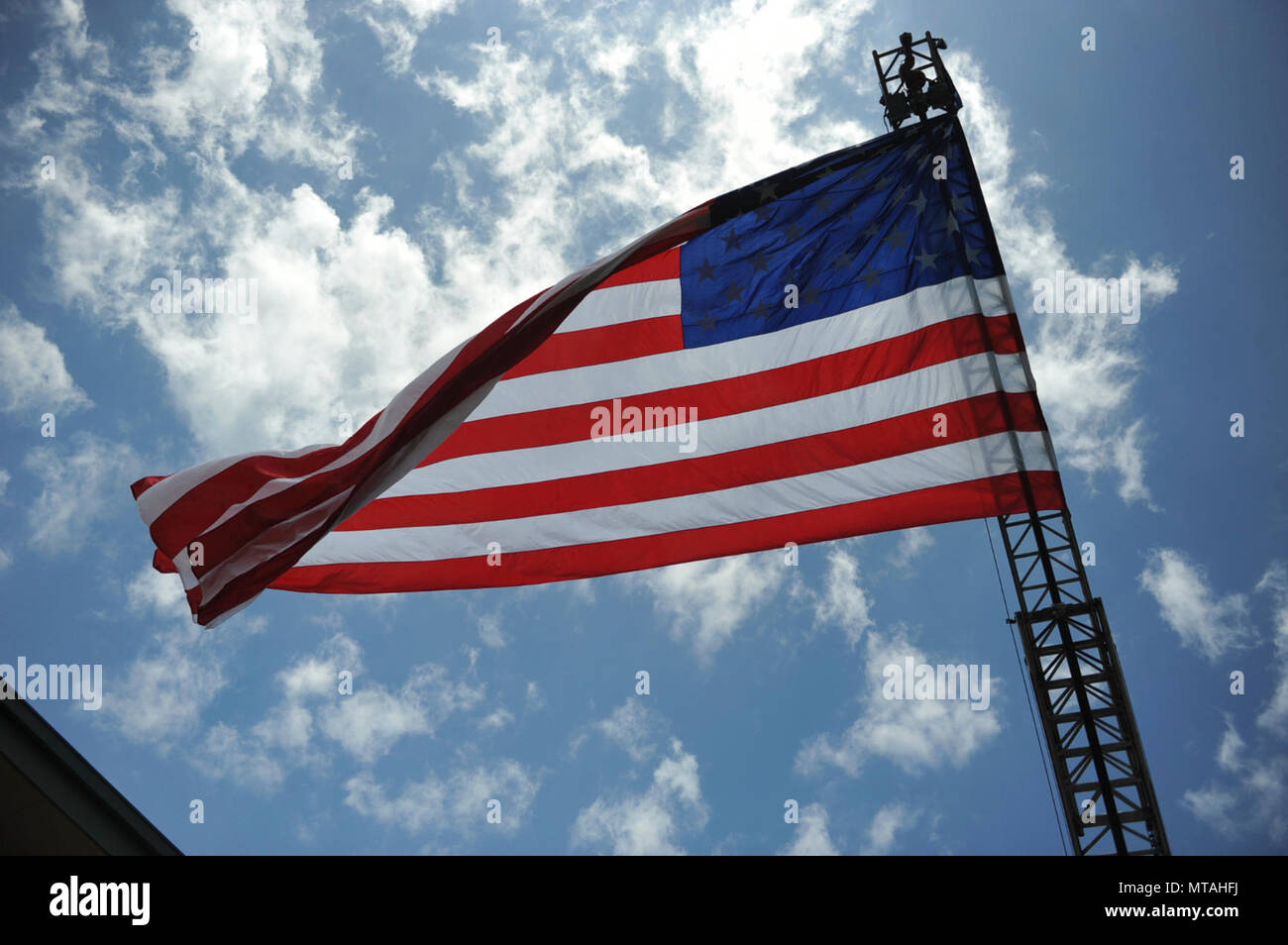 The United States flag hangs from the ladder of the Puerto Rico Fire ...