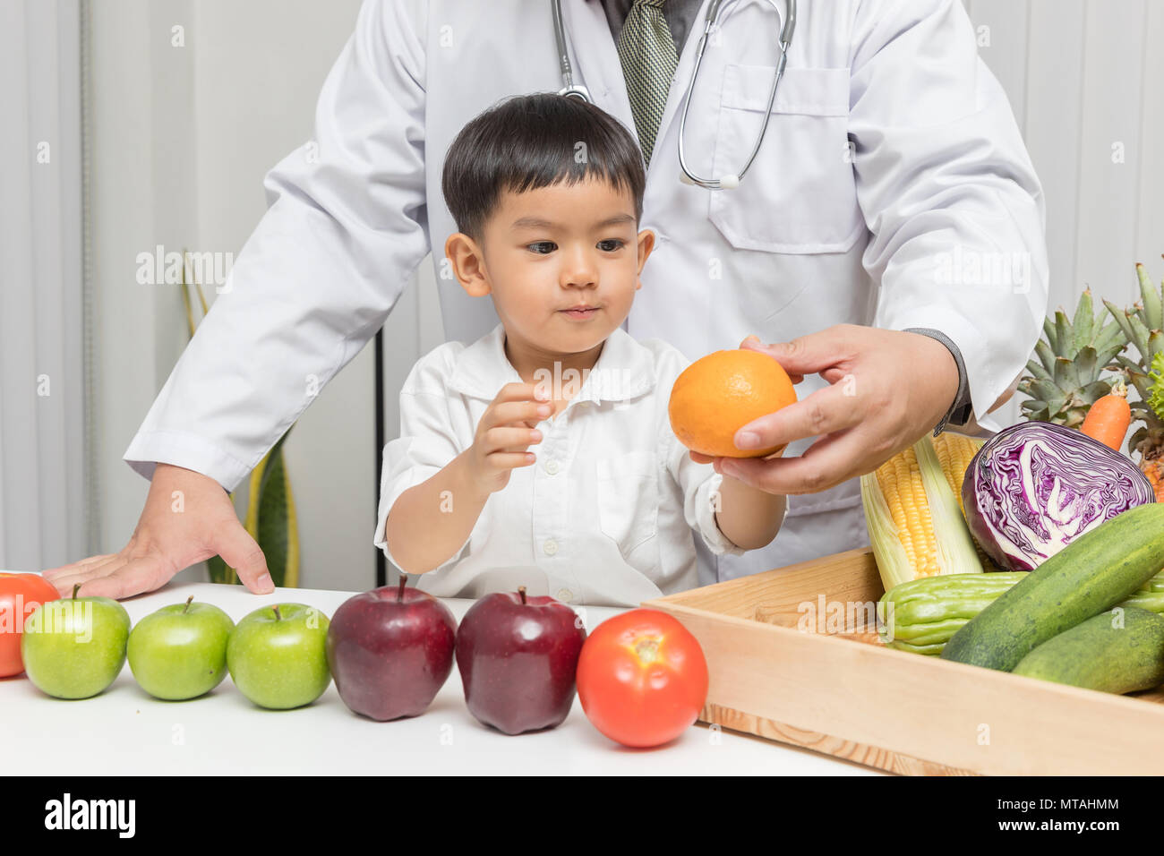 Healthy and nutrition concept. Kid learning about nutrition with doctor ...