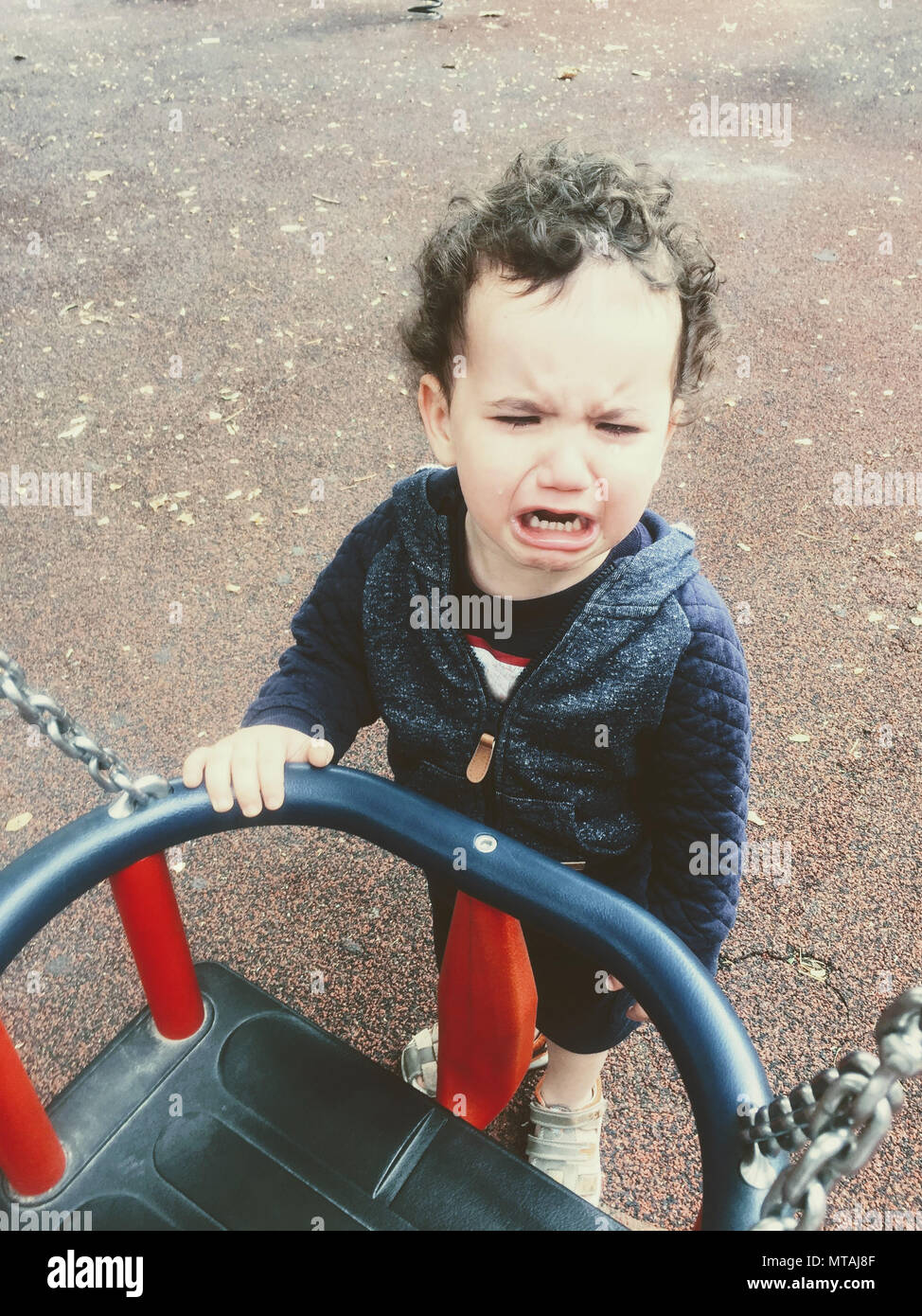 Child feeling alone playground hi-res stock photography and images - Alamy