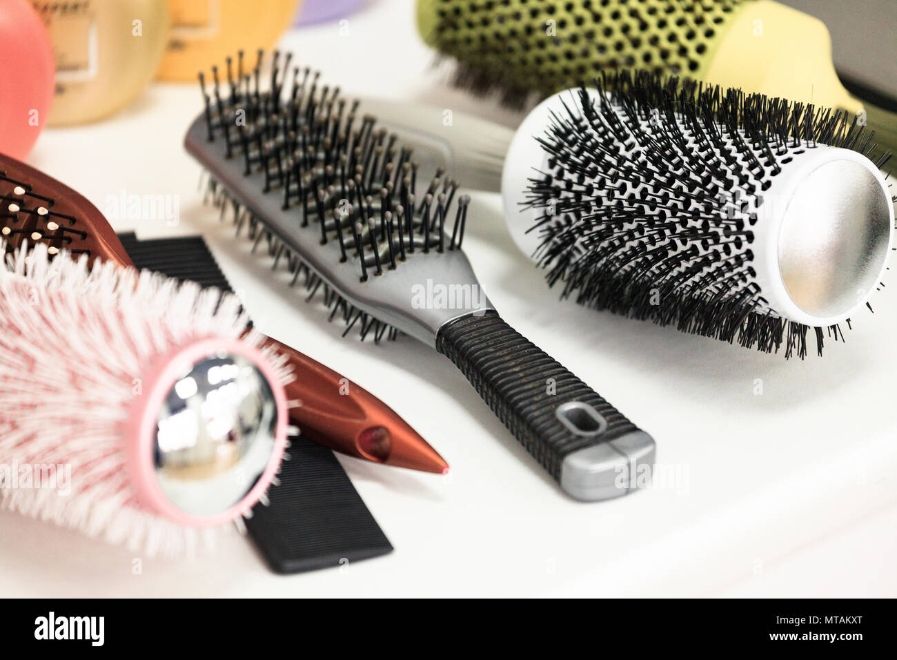 Various combs on a table Stock Photo - Alamy