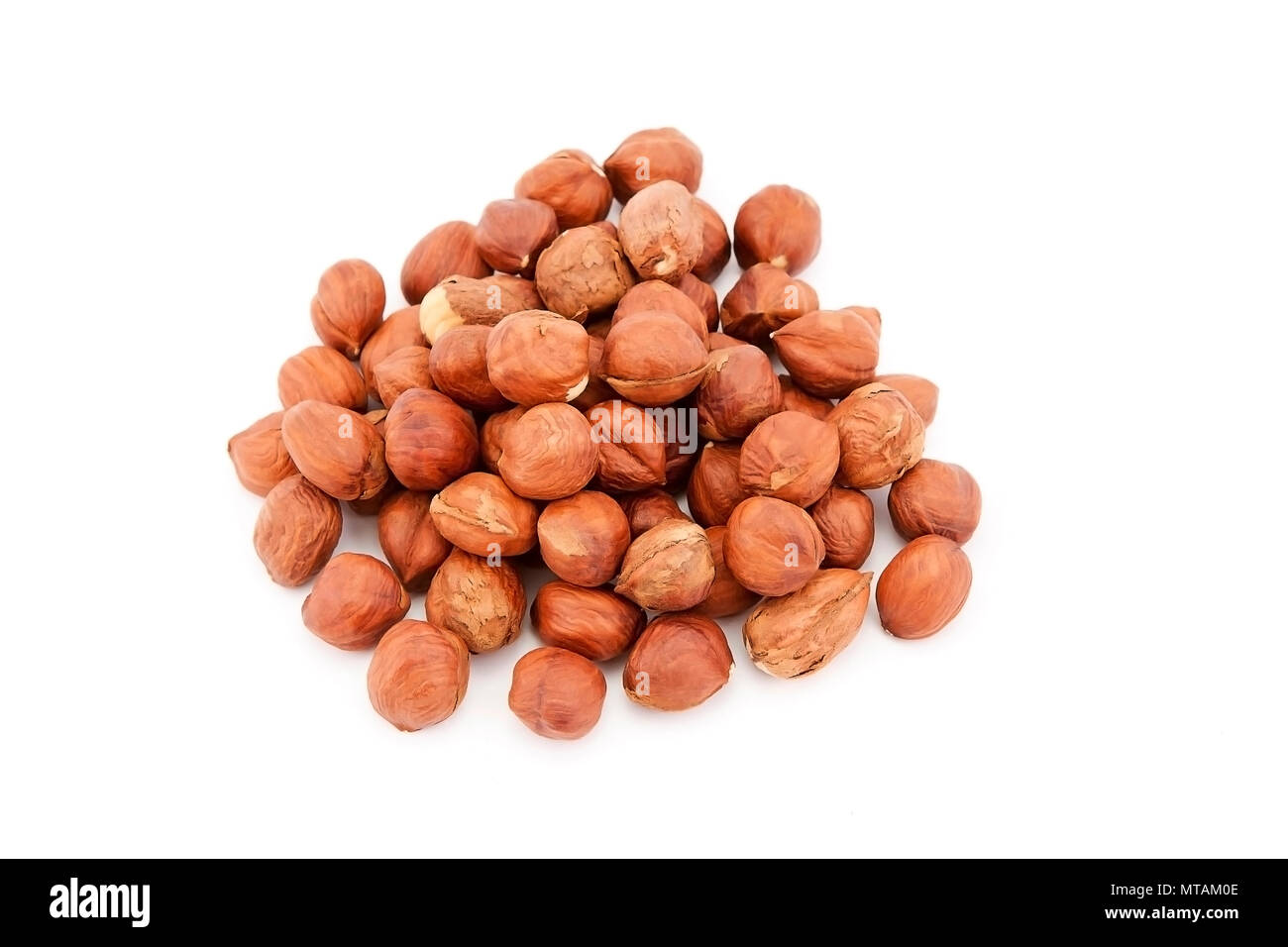 Heap of hazelnuts isolated on white background Stock Photo - Alamy