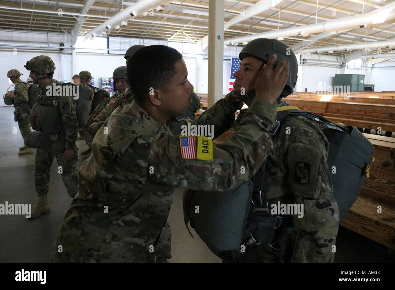 U.S. Army Staff Sgt. David Smith, left, assigned to the 824th ...