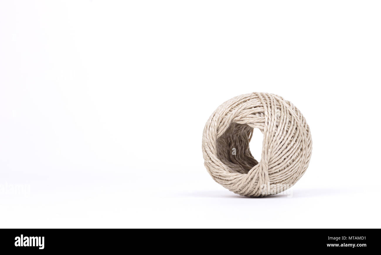 Small ball of rope isolated on a white background Stock Photo - Alamy