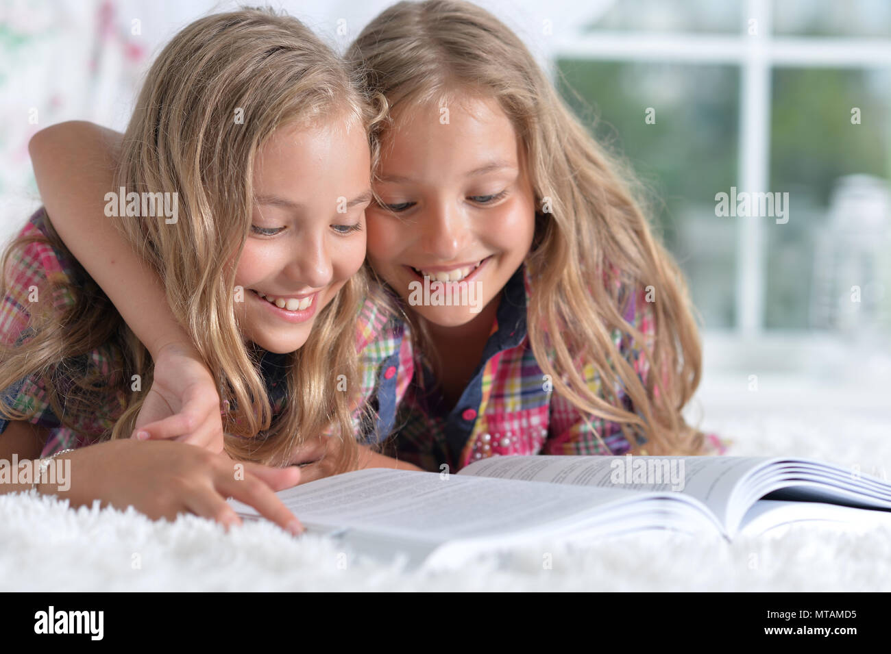 two adorable twin sisters Stock Photo - Alamy