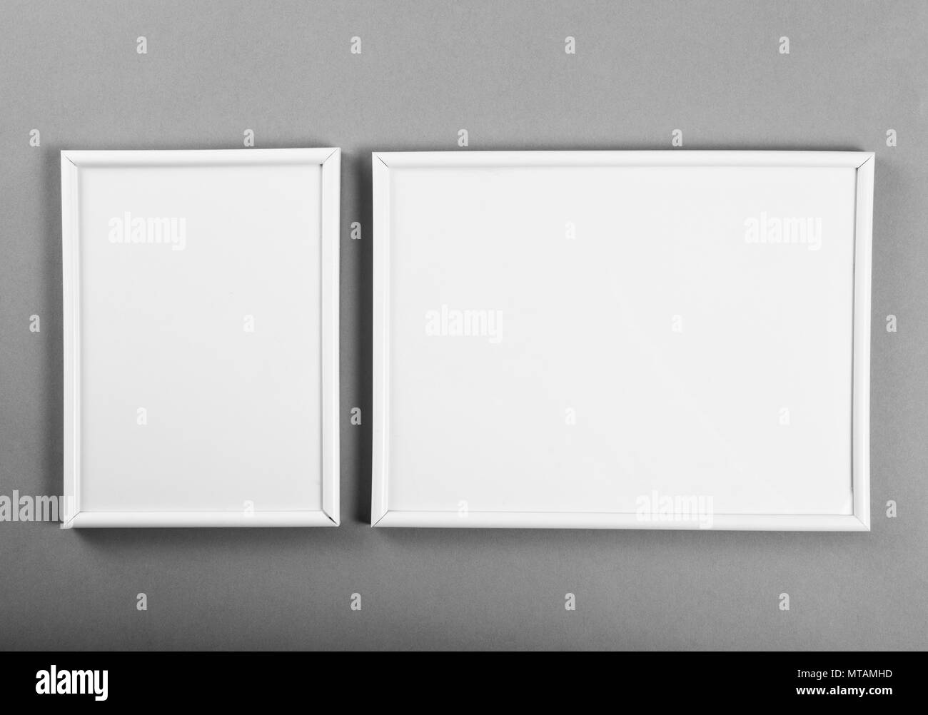 White frames for paintings or photographs on gray background Stock ...