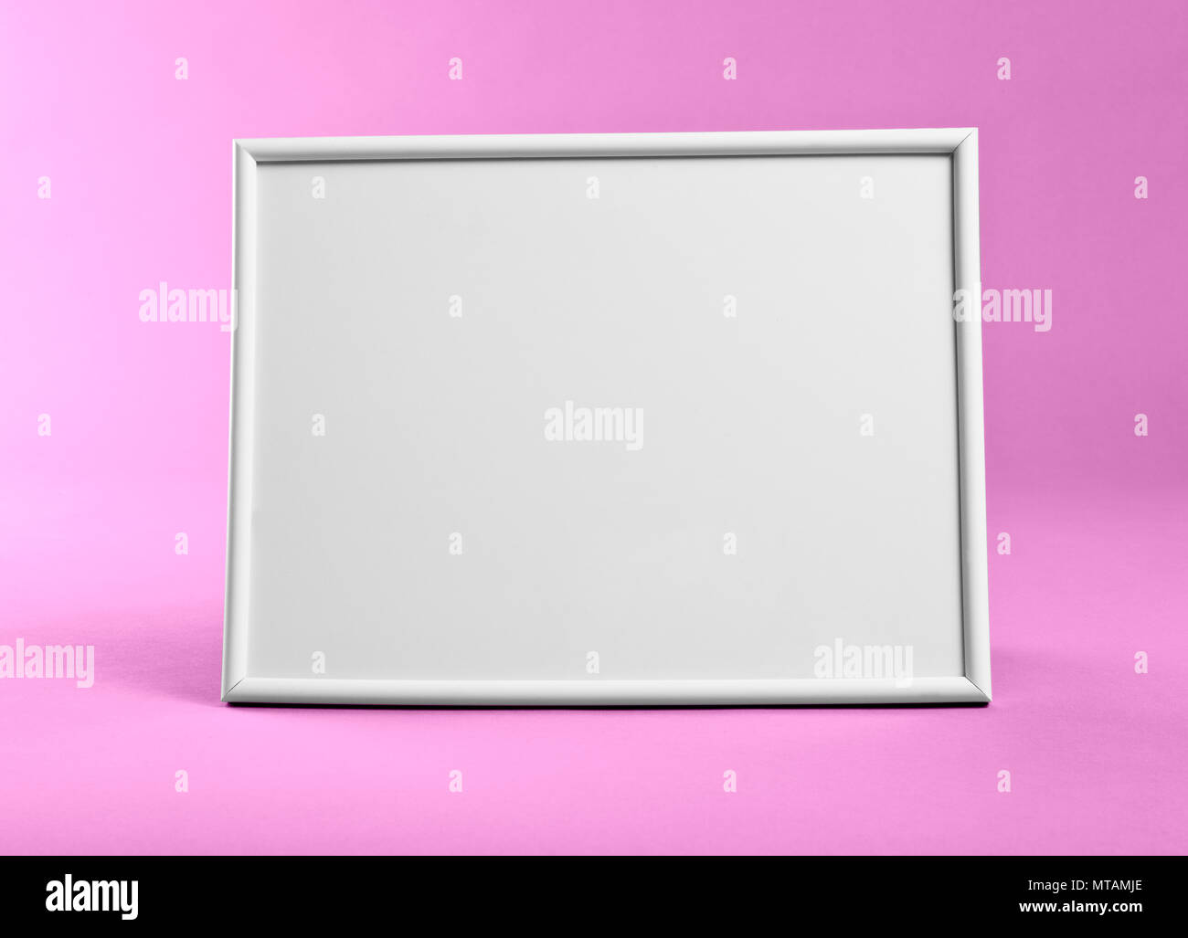 White frame for paintings or photographs on pink background Stock Photo ...