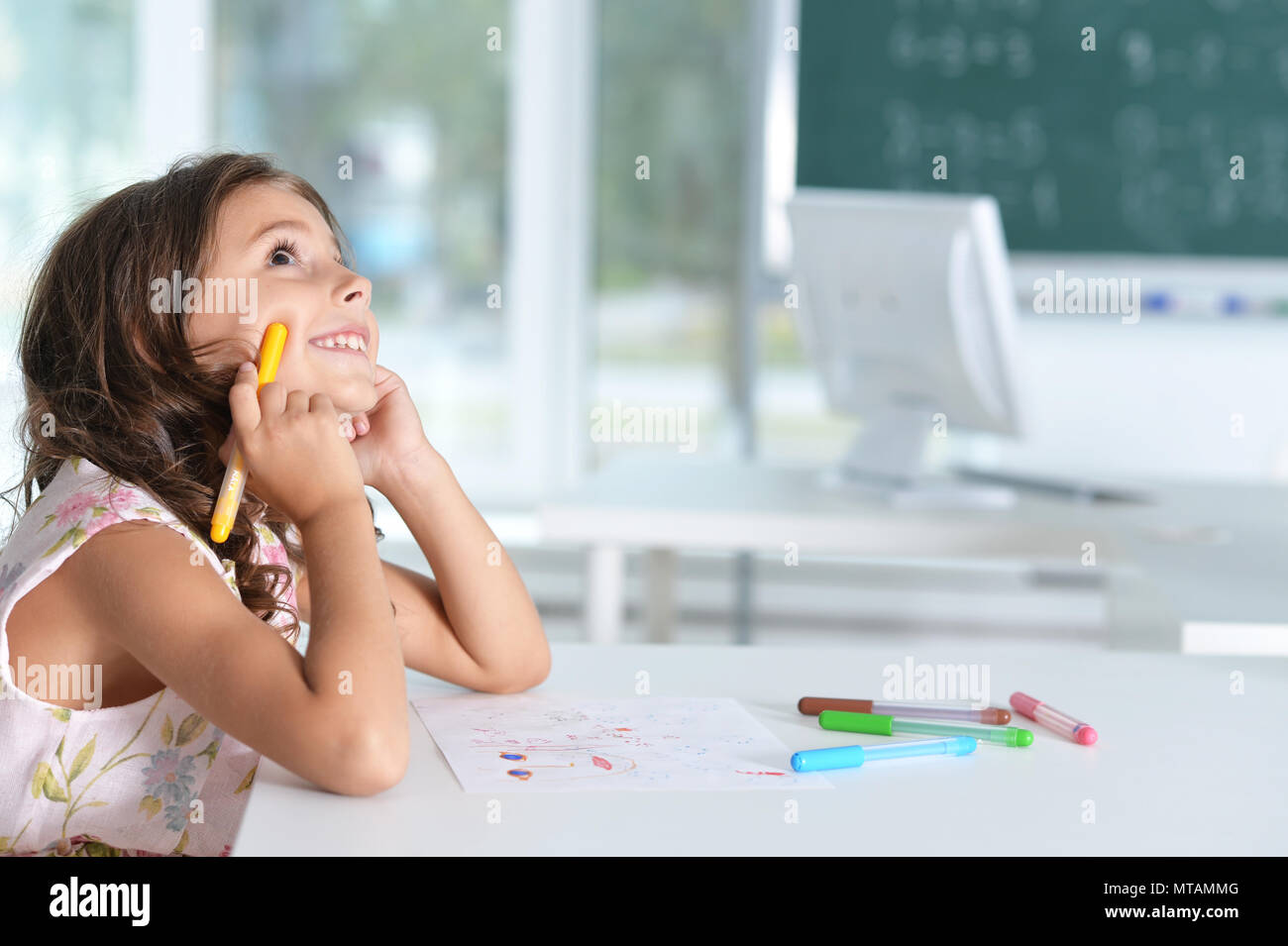 Cute little girl doing homework Stock Photo - Alamy