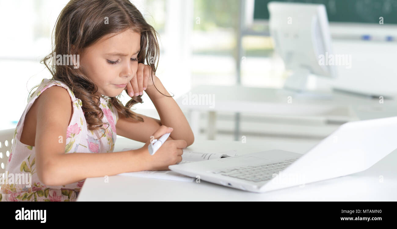 Cute little girl doing homework Stock Photo - Alamy